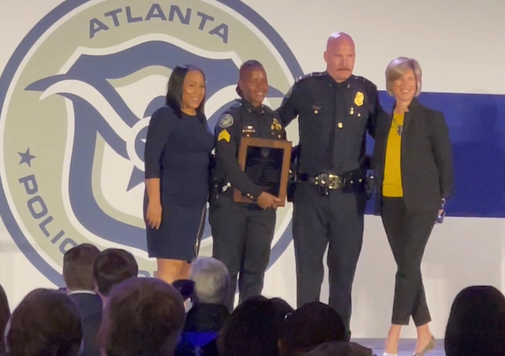 Katie Kirkpatrick Presents Award at APD Crime is Toast Breakfast ...